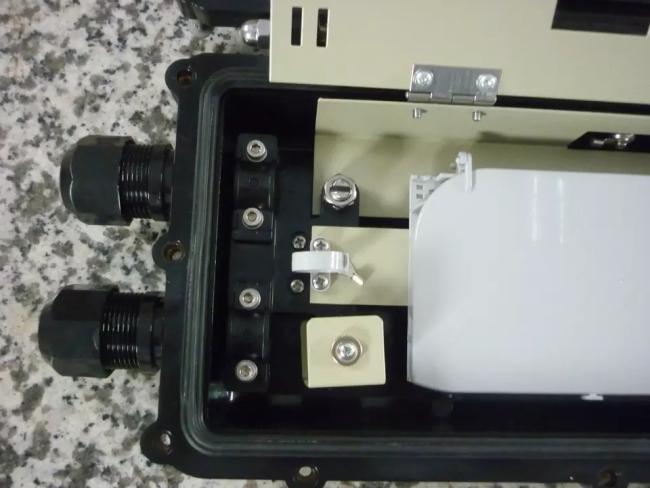 KCO-GJS114 outdoor optical splitter splice box exterior view showing four cable ports and waterproof housing