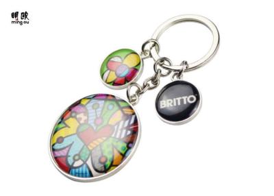 China Keyrings feitos sob encomenda dados forma redondos do metal com logotipo bonito da etiqueta da cola Epoxy para o suporte chave à venda