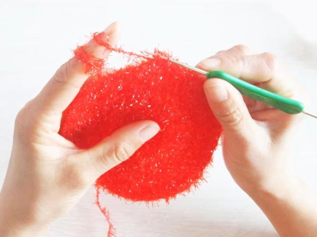Close-up view of watermelon sponge scrubber design