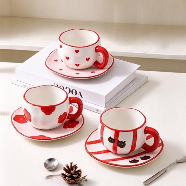 Irregular shaped ceramic saucer with matching floral cup