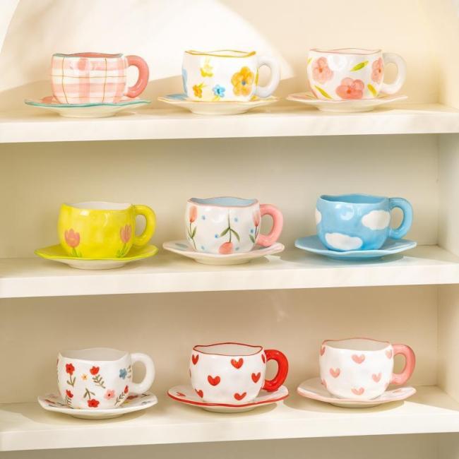 Floral ceramic coffee mug and irregular saucer set, front view