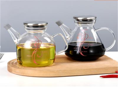 Cina Dispenser per olio in vetro borosilicato alto da 700 ml Dispenser per salse Contenitori in vetro trasparente in vendita