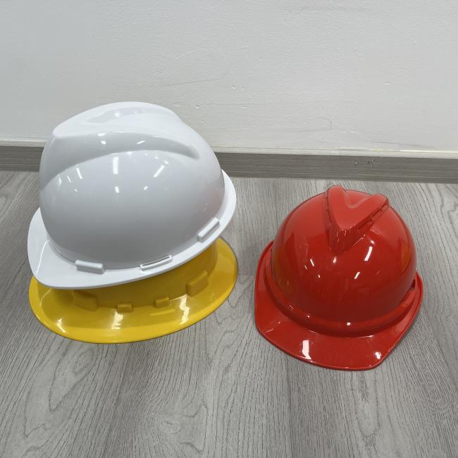 Hard hat showing adjustable headband and pin lock system