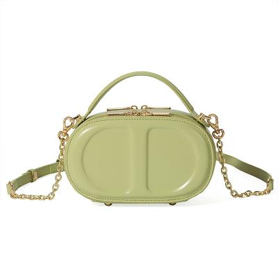 Cina Piccola borsa di cuoio di mucca ovale per donne versatile borsa da spalla in cuoio originale in vendita