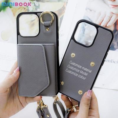 Cina Minibook Cassa per telefono in cuoio con cinghia per iPhone 14 pro max in vendita