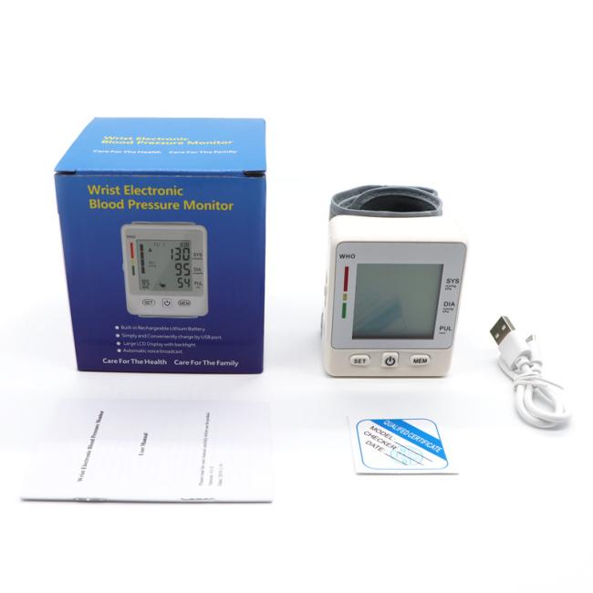 Wrist BP Monitor with accessories including batteries and carrying case