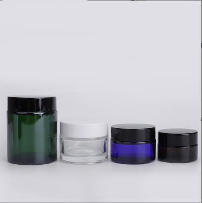 中国 5g 10g 15g 20g 30g 50g 100gのプラスチック帽子が付いている黒く明確なこはく色の紫色のガラス クリームの瓶 販売のため