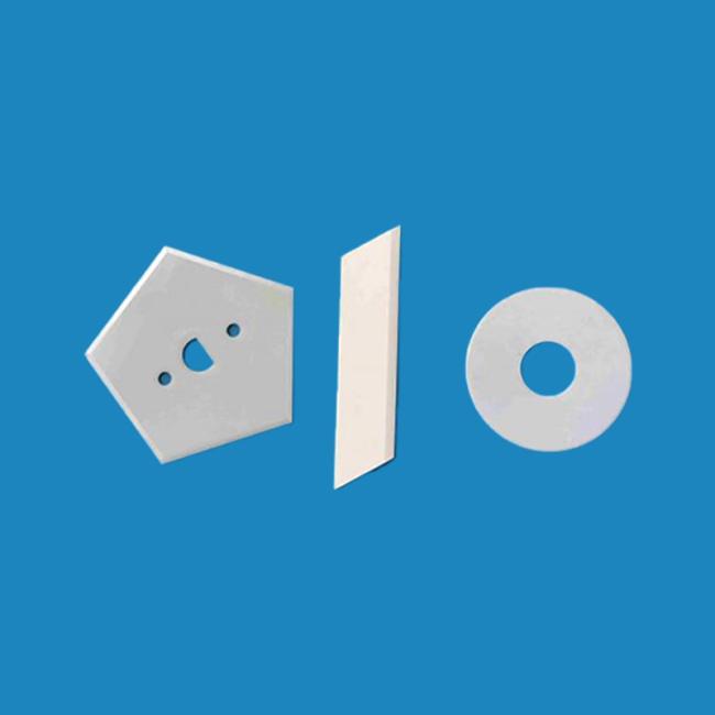 Precision machined zirconia ceramic parts showing white color and smooth surface