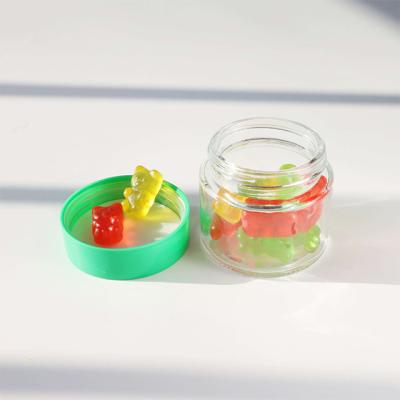China Container de armazenamento de doces de flores de ervas daninhas de vidro redondo liso com tampa de parafuso à prova de crianças à venda