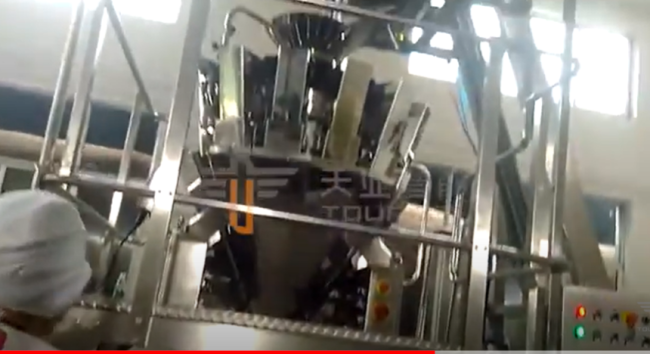 Close-up view of 12 head weighing system