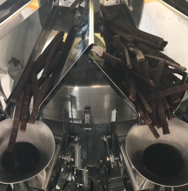 Close-up view of precision weighing hoppers in SUS 316 construction