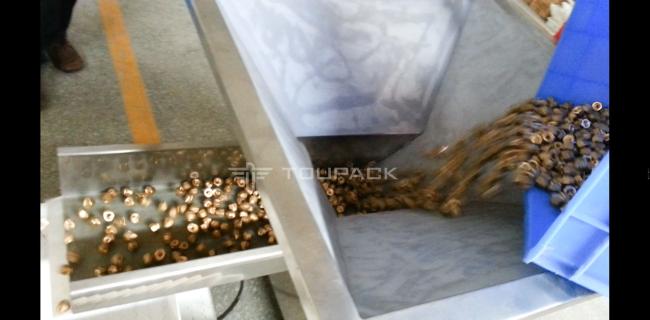 Close-up of vibration bowl feeding system