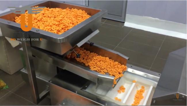 Vibrating feeder component for snack food packaging