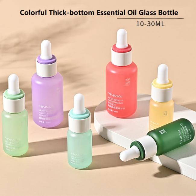 Colorful thick-bottom cylindrical glass dropper bottles for cosmetic essence and essential oil packaging