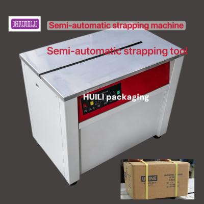 China Semi-automatic strapping machine 12mm PP strap Automatic strapping machine 220V/60HZ for sale