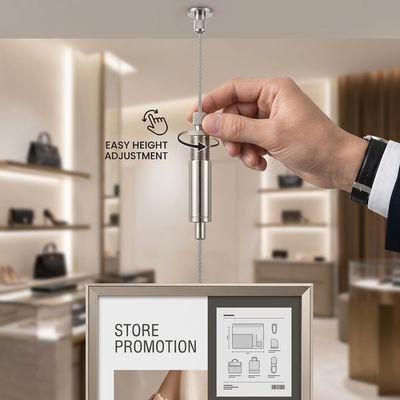 Adjustable bottom exit brass cable gripper application in signage display hanging system