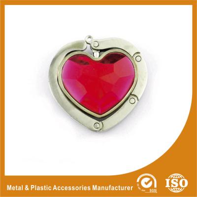 Cina Ganci di gancio portatili della borsa del metallo di lusso per forma del cuore delle borse in vendita