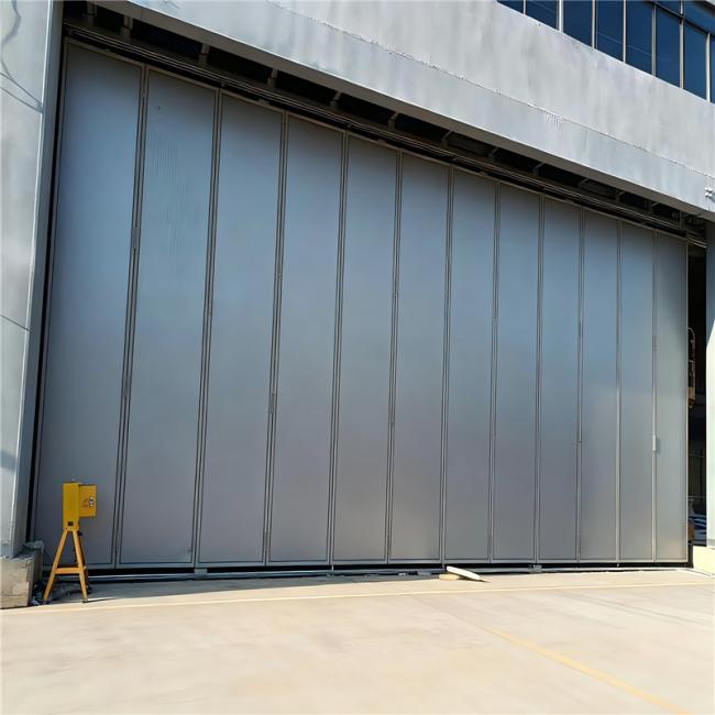 Industrial folding door installation in commercial facility