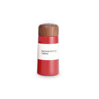 Chine Bouteille d'eau à double paroi en acier inoxydable à grain de bois mini pour une couleur personnalisée à vendre