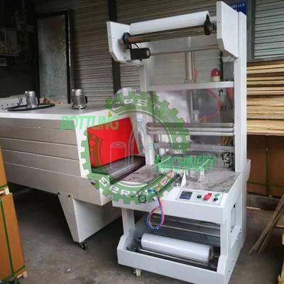 Cina Il film automatico del PE dei semi riscalda la macchina imballatrice della bottiglia di acqua degli strizzacervelli in vendita