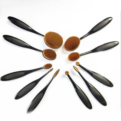Cina Il trucco dello spazzolino da denti spazzola la spazzola di trucco di bellezza del fronte del fondamento dei cosmetici con la maniglia blu dello spruzzo di colore in vendita