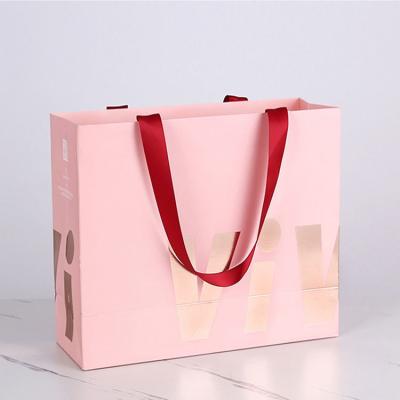 中国 カスタマイズされたデザインと黒いリボンハンドルと象牙色のホワイトの食品持ち帰り袋 販売のため