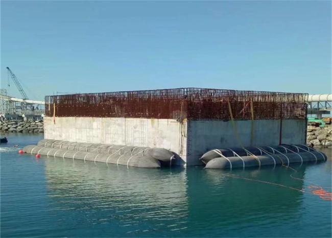 Marine salvage operation with airbags lifting sunken vessel