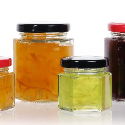 China High Quality Customized Hexagon Shape Glass Jar for Honey Jams Food Storage With Lid for sale