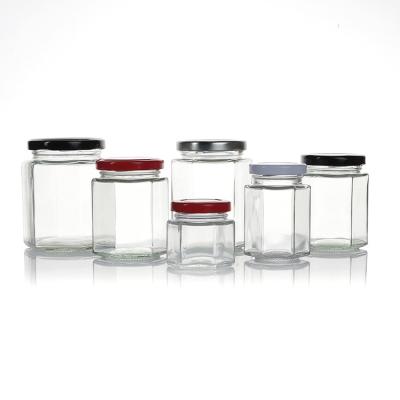 China Wholesale Price Available Different Sizes Full Foam Packing Hexagonal Honey Jars Glass for sale