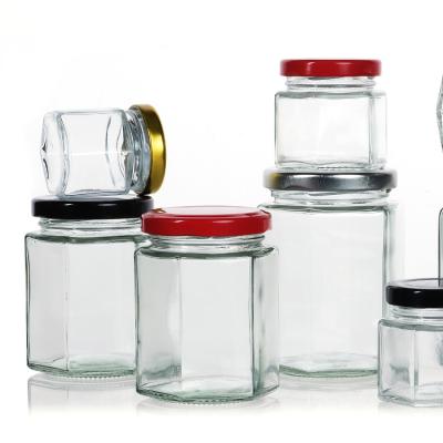 China Hexagon Shaped Honey Jam Jar Glass 180ml /280ml / 380ml 250g 390g 500g Food Jars With Cover for sale