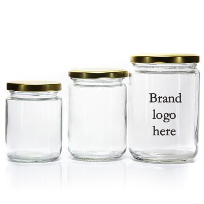 China Custom Logo Wholesale Food Grade Transparent Round Food Storage Glass Container Jar With Screw Metal Lid for Food Packing for sale