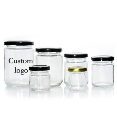 China Custom Logo Transparent Food Storage Container Round Jam Food Grade Glass Jars With Mental Screw Lids for Food Packing for sale