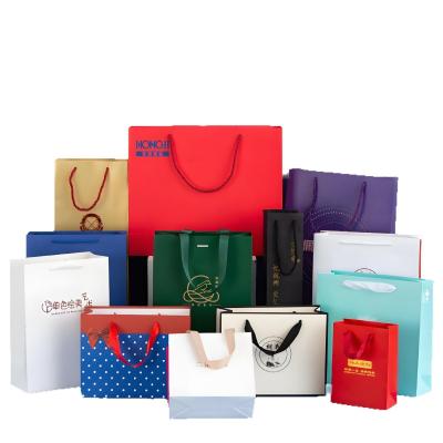 China ISO Shopping Paper Bags Red Purple Clothing Shopping Bags Logo Custom for sale