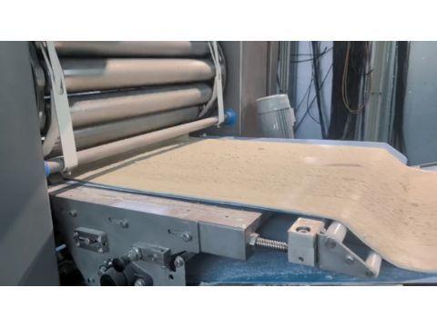 Industrial satellite roller system rolling high-hydration dough band up to 85% water content gently without tension.