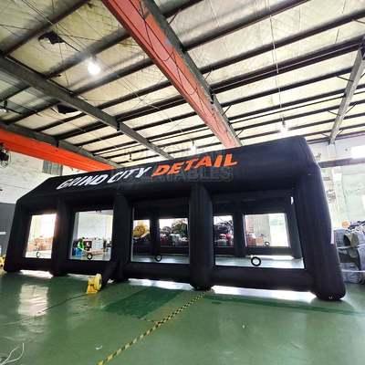 Complete black inflatable car wash tent showing wide drive-through structure and custom roof branding