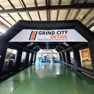 Interior drive-through view of inflatable car wash tent with reinforced roof beams