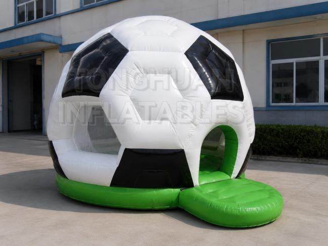 · football inflatable bounce house with green entrance step and enclosed play area