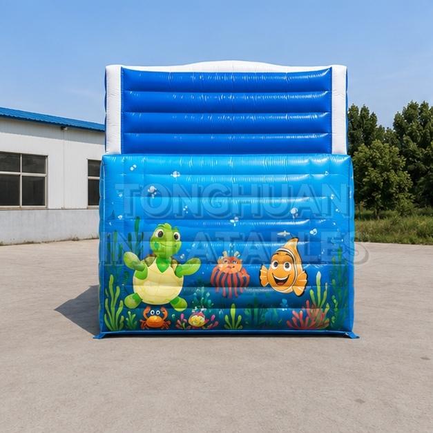 kids inflatable water slide with fish turtle coral artwork and front pool landing area