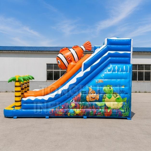 clownfish inflatable slide with climbing lane palm tree obstacles and bright colors