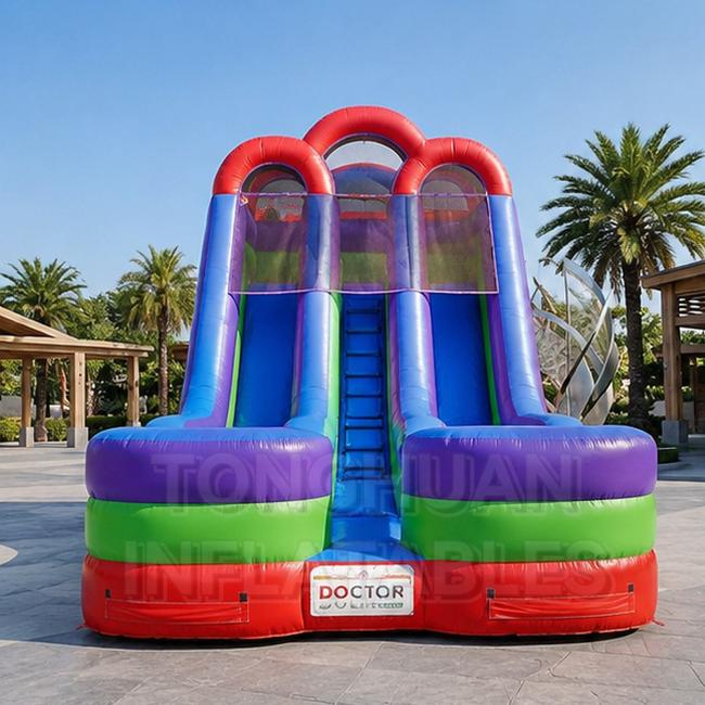 colorful dual lane inflatable dry slide with mesh safety net for kids parks and rentals