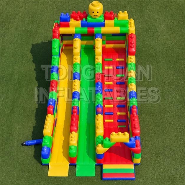 kids double lane inflatable slide with bright block theme decorations