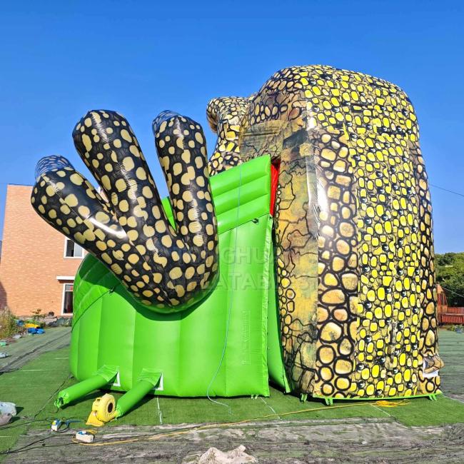 Large crocodile inflatable amusement slide tested outdoors before delivery