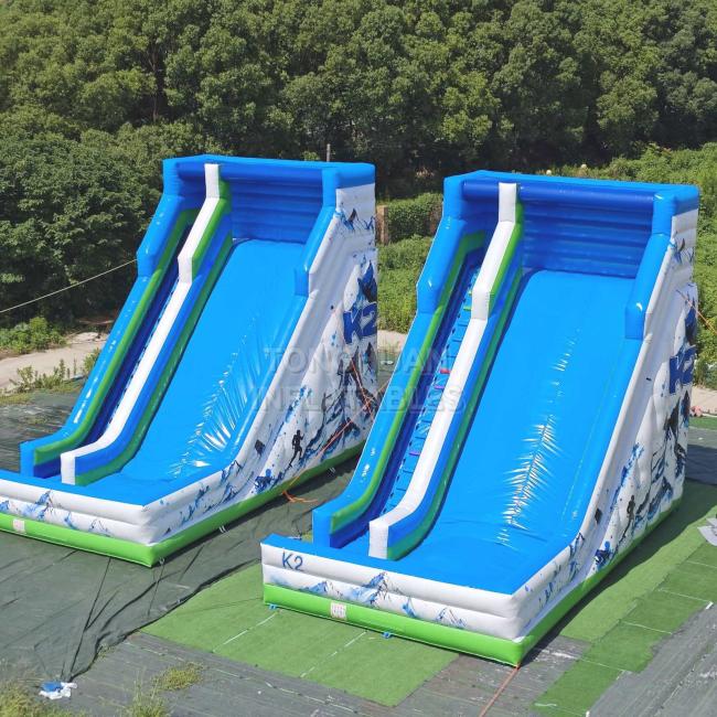 K2 mountain theme inflatable slide showing twin lanes and reinforced side walls