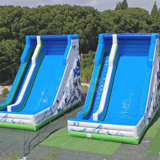Commercial blue and white K2 inflatable slide front view for parks and event rentals