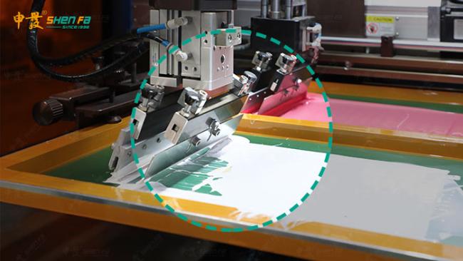 Screen printing machine in operation