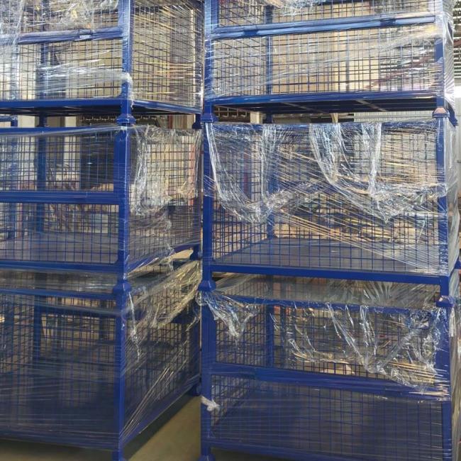 Multiple steel pallet boxes stacked together