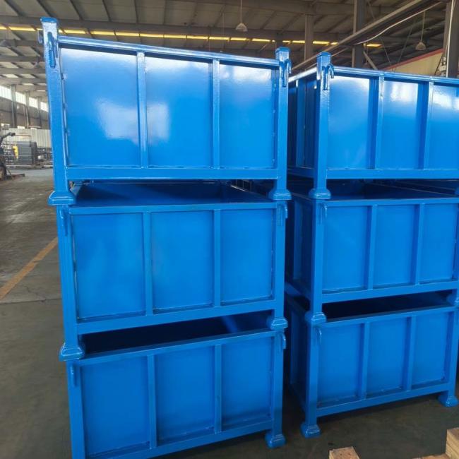 Stacked metal storage boxes in warehouse