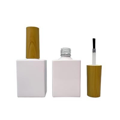 Cina Bottiglia di vetro dello smalto del quadrato 10ml 12ml 15ml con il cappuccio di legno di bambù della spazzola del grano in vendita