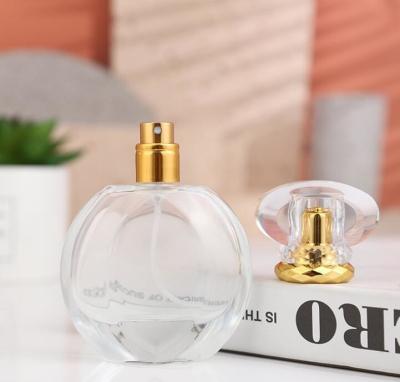 China SGS Round Transparent Perfume Bottle 50ml 60ml Glass Cologne Bottles for sale