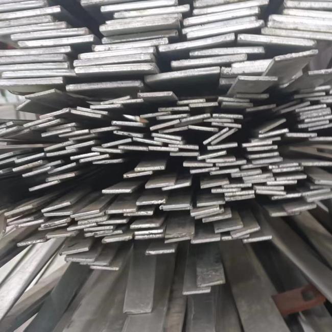 Galvanized flat steel rolls in warehouse storage